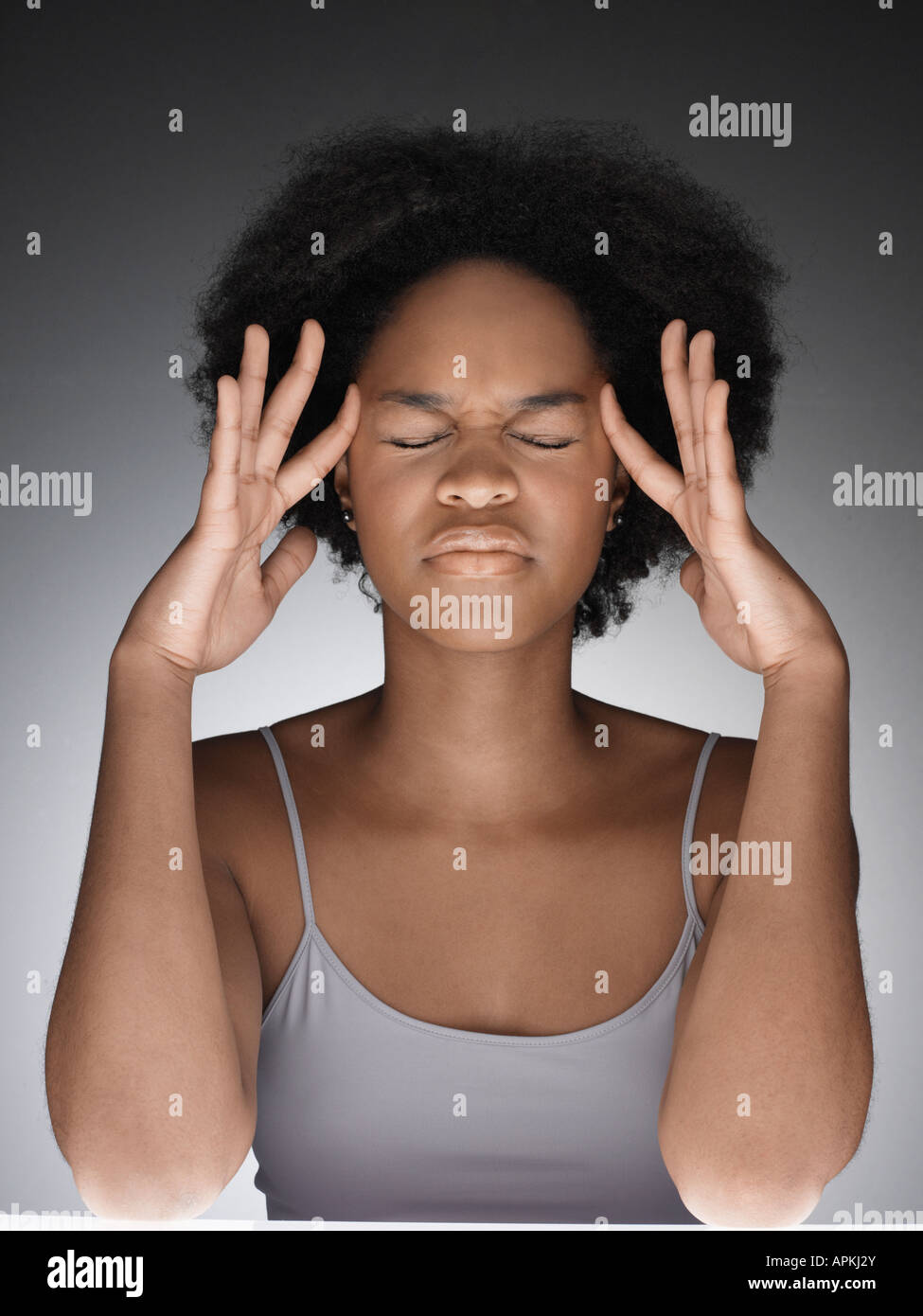 Young woman thinking with hands on face Stock Photo - Alamy