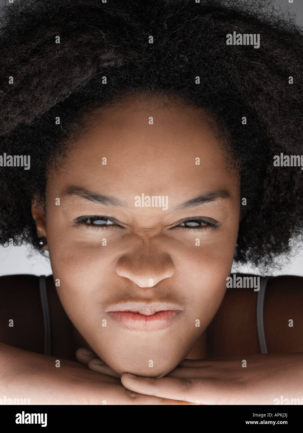 Young woman grimacing (portrait Stock Photo - Alamy