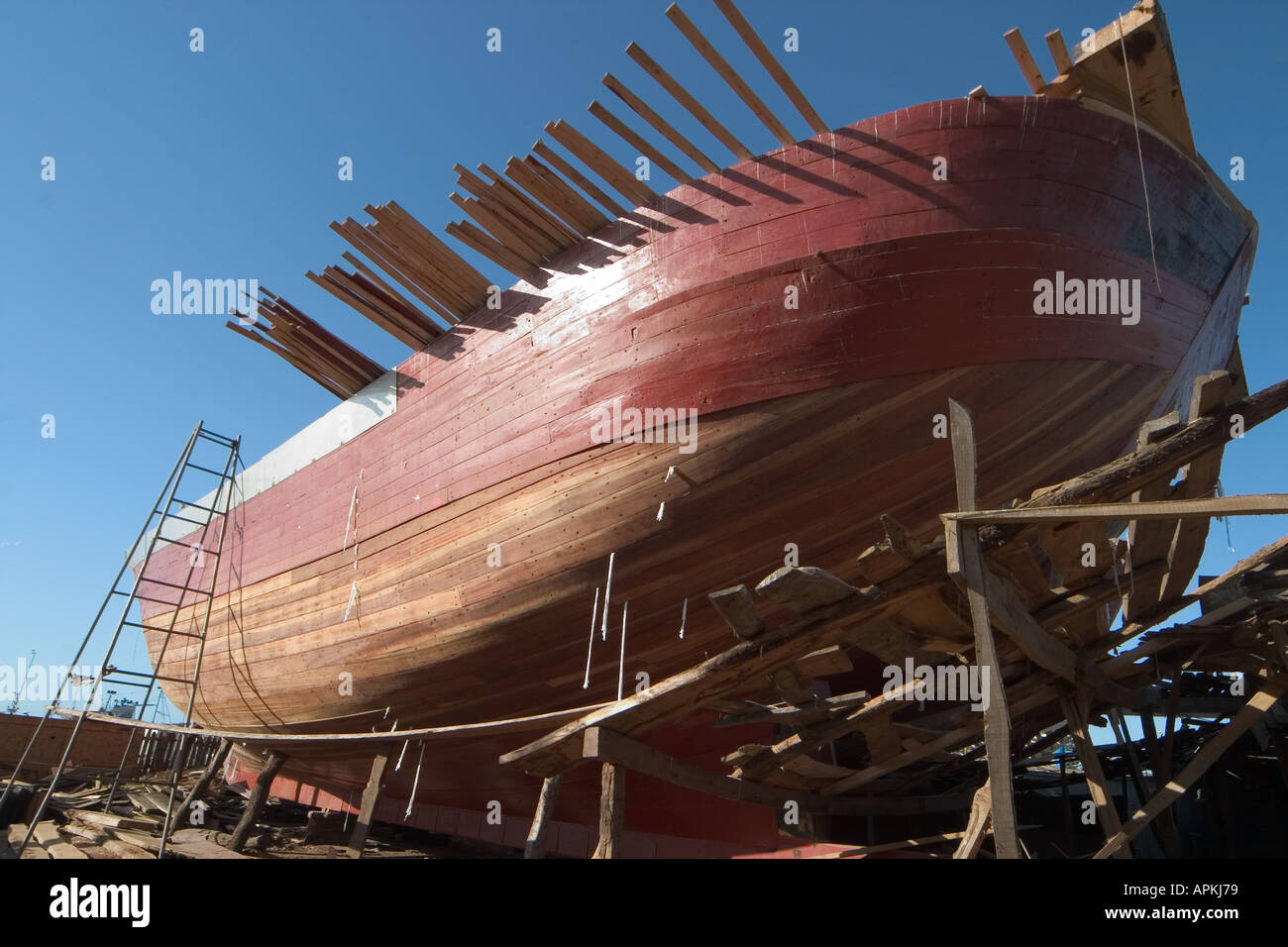 traditional wooden fishing boat under construction showing caulking ...