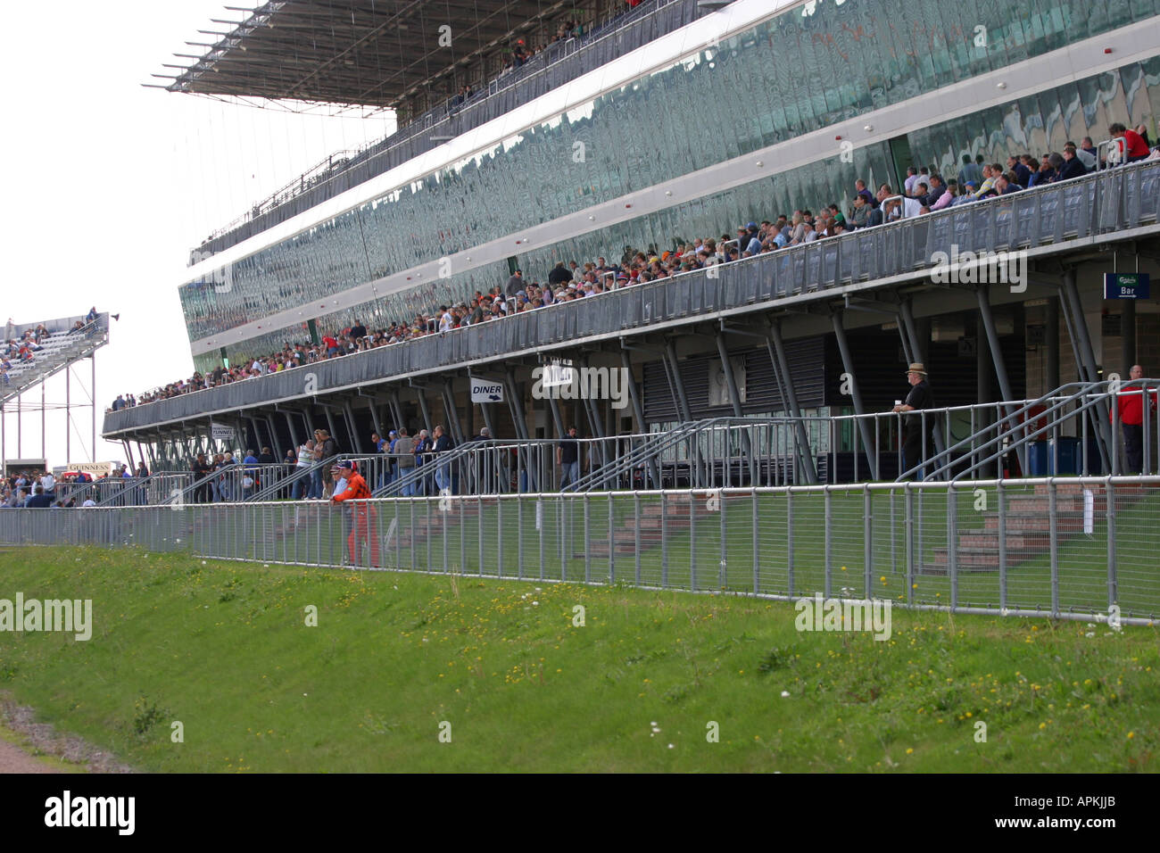 Spectators in the grandstand at a motor sport meeting Stock Photo - Alamy