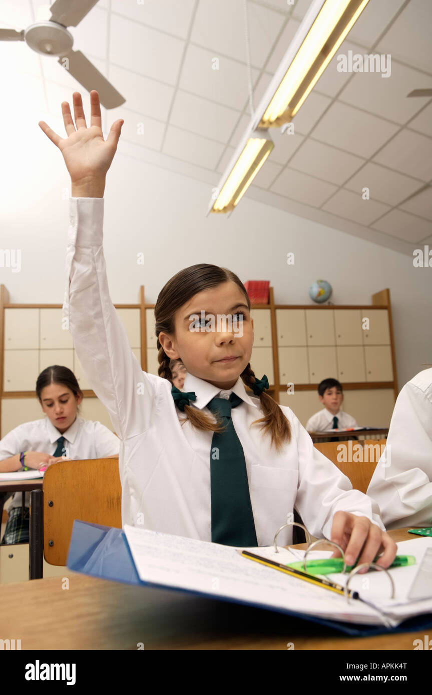 Kids raise their hand in class hi-res stock photography and images - Alamy