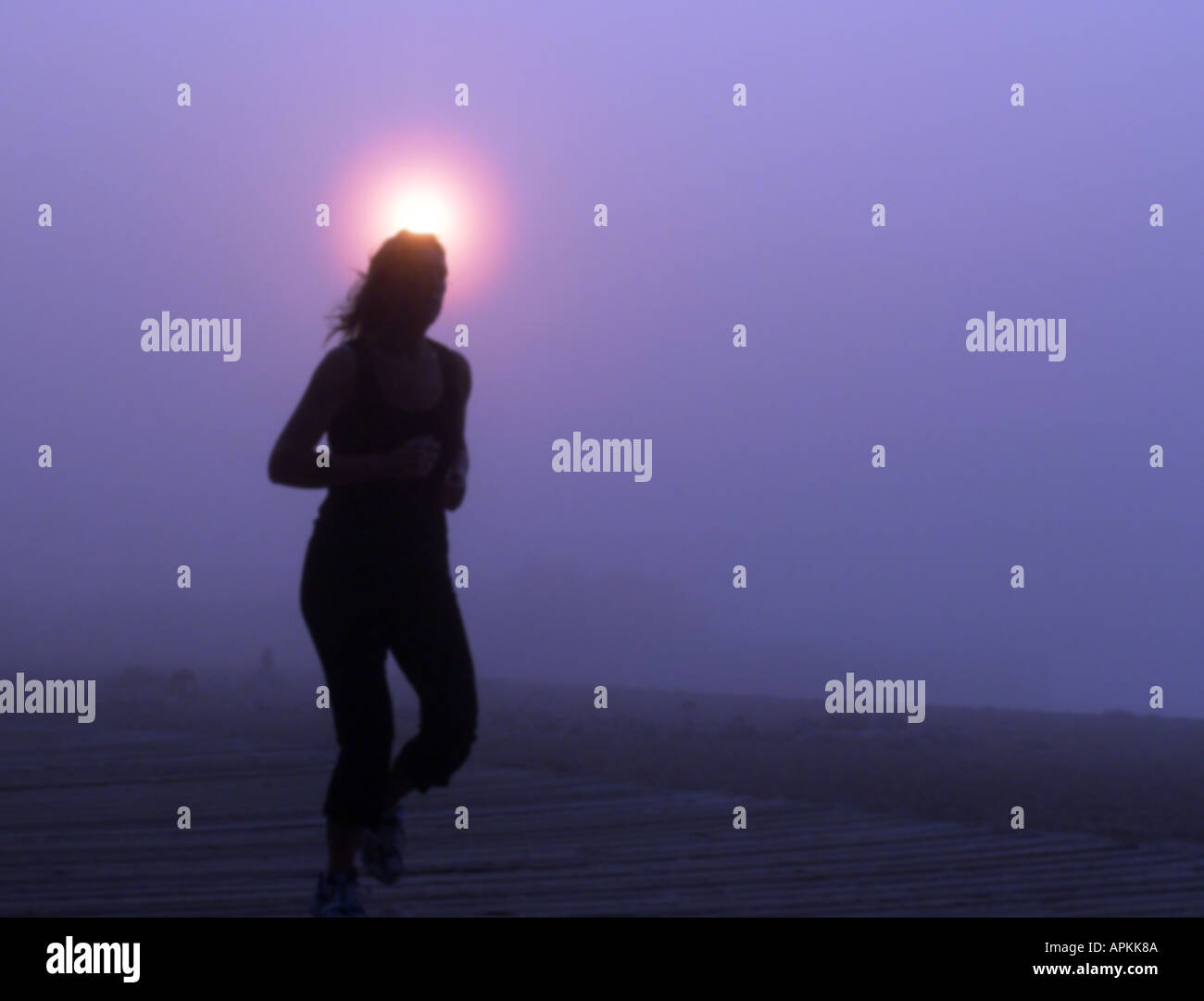 running on the beach early morning sunrise Stock Photo - Alamy