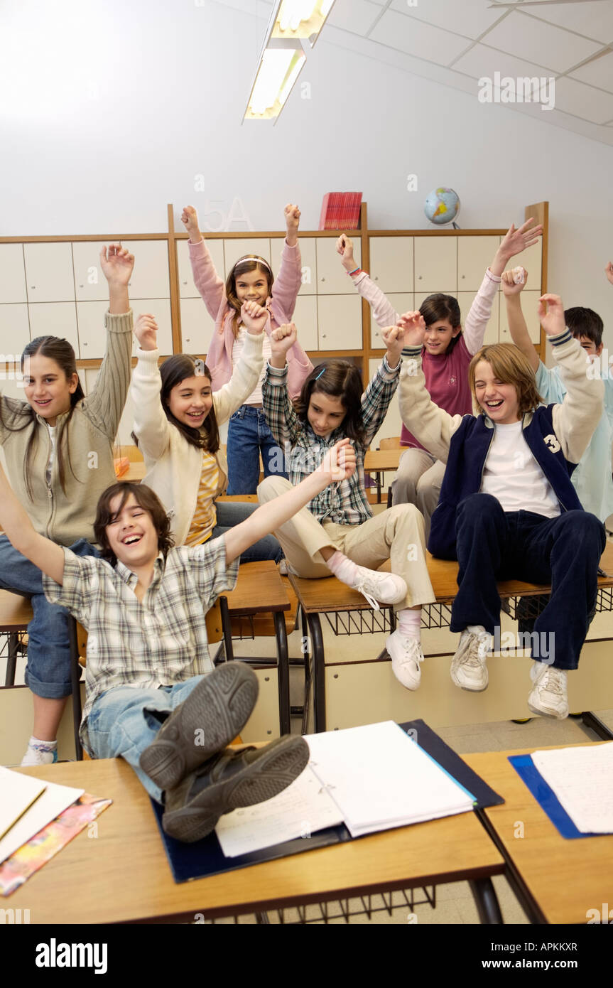 Students cheering in classroom hi-res stock photography and images - Alamy