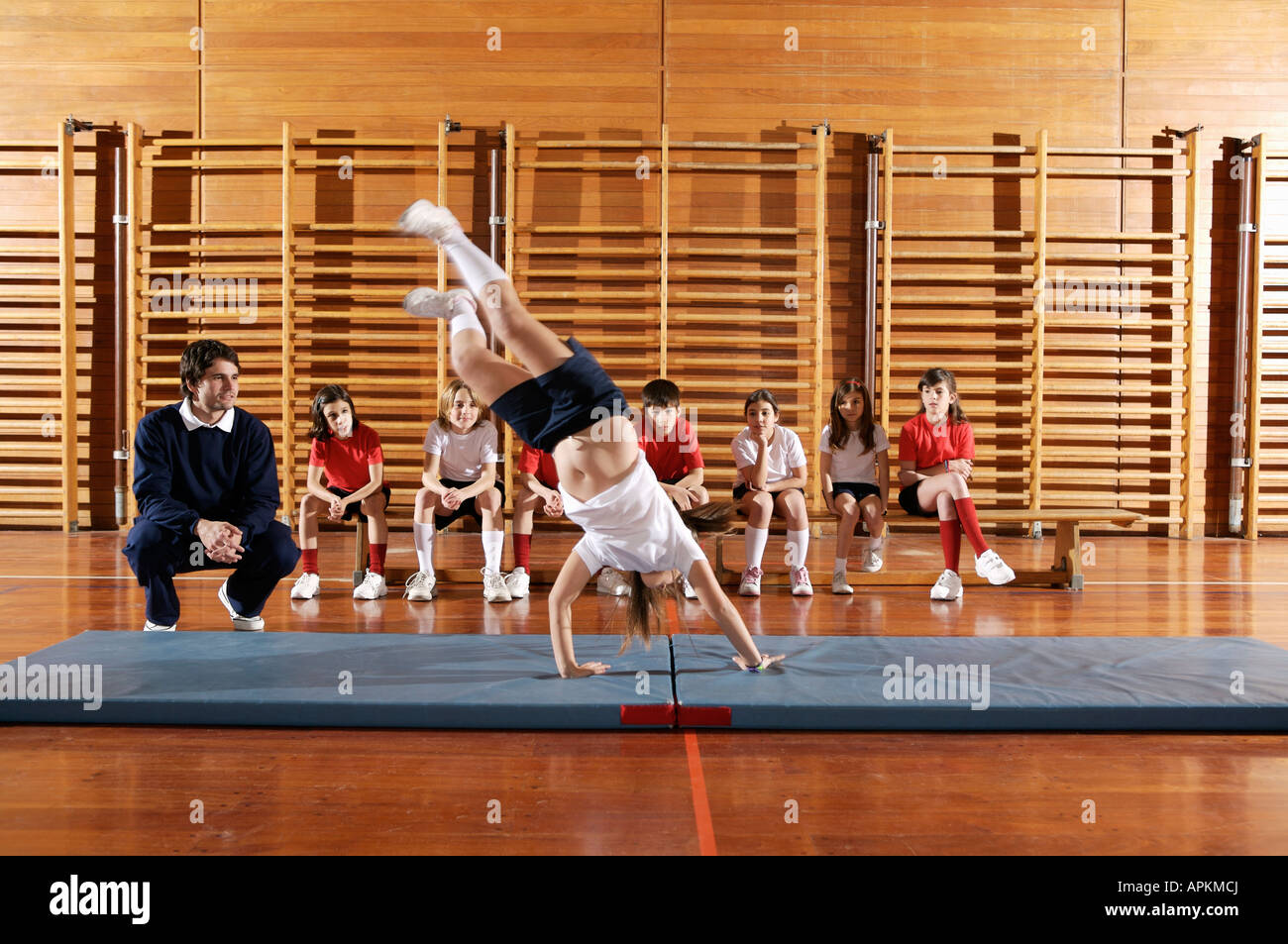 Students and teacher in school gym Stock Photo - Alamy
