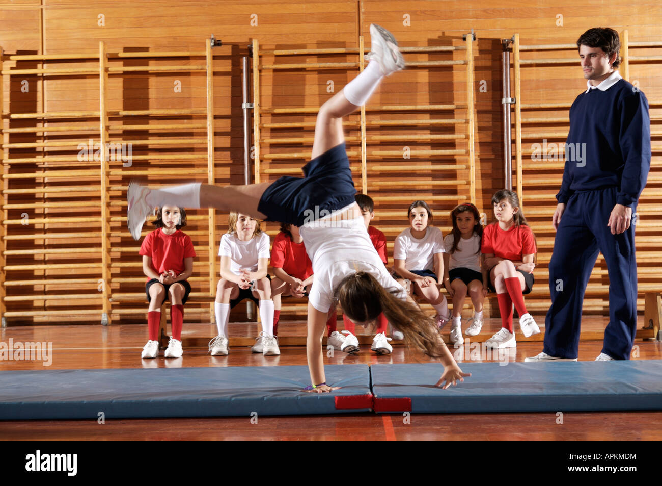 Students and teacher in school gym Stock Photo - Alamy