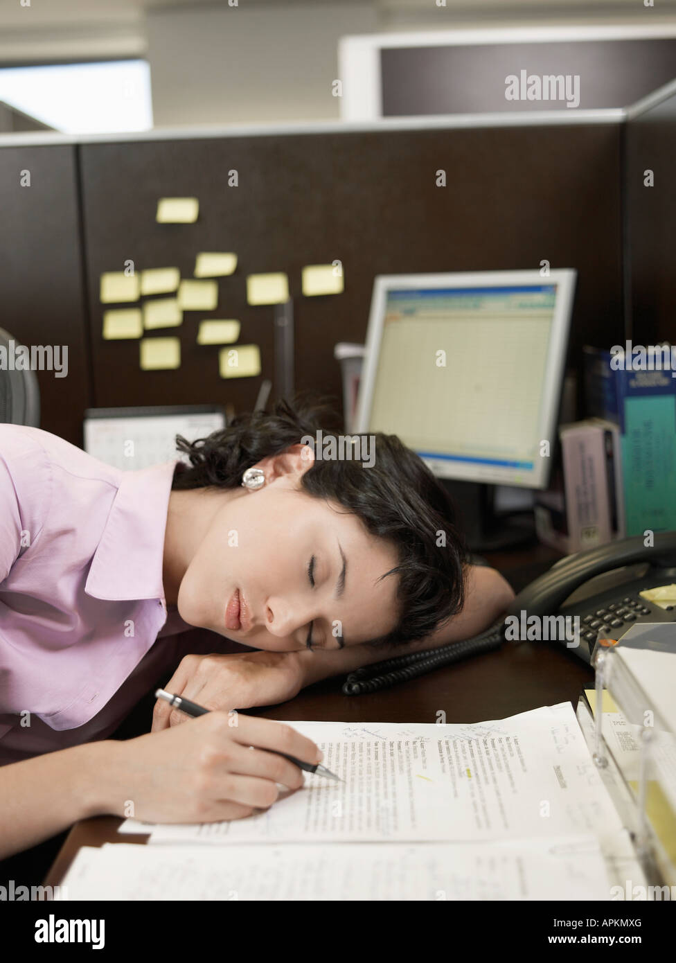 Office worker sleeping on documents Stock Photo - Alamy