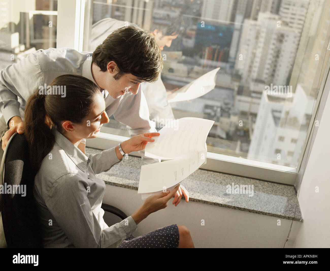 Working young man reading documents hi-res stock photography and images ...