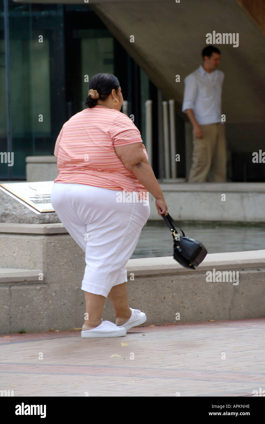Overweight female walking Stock Photo - Alamy