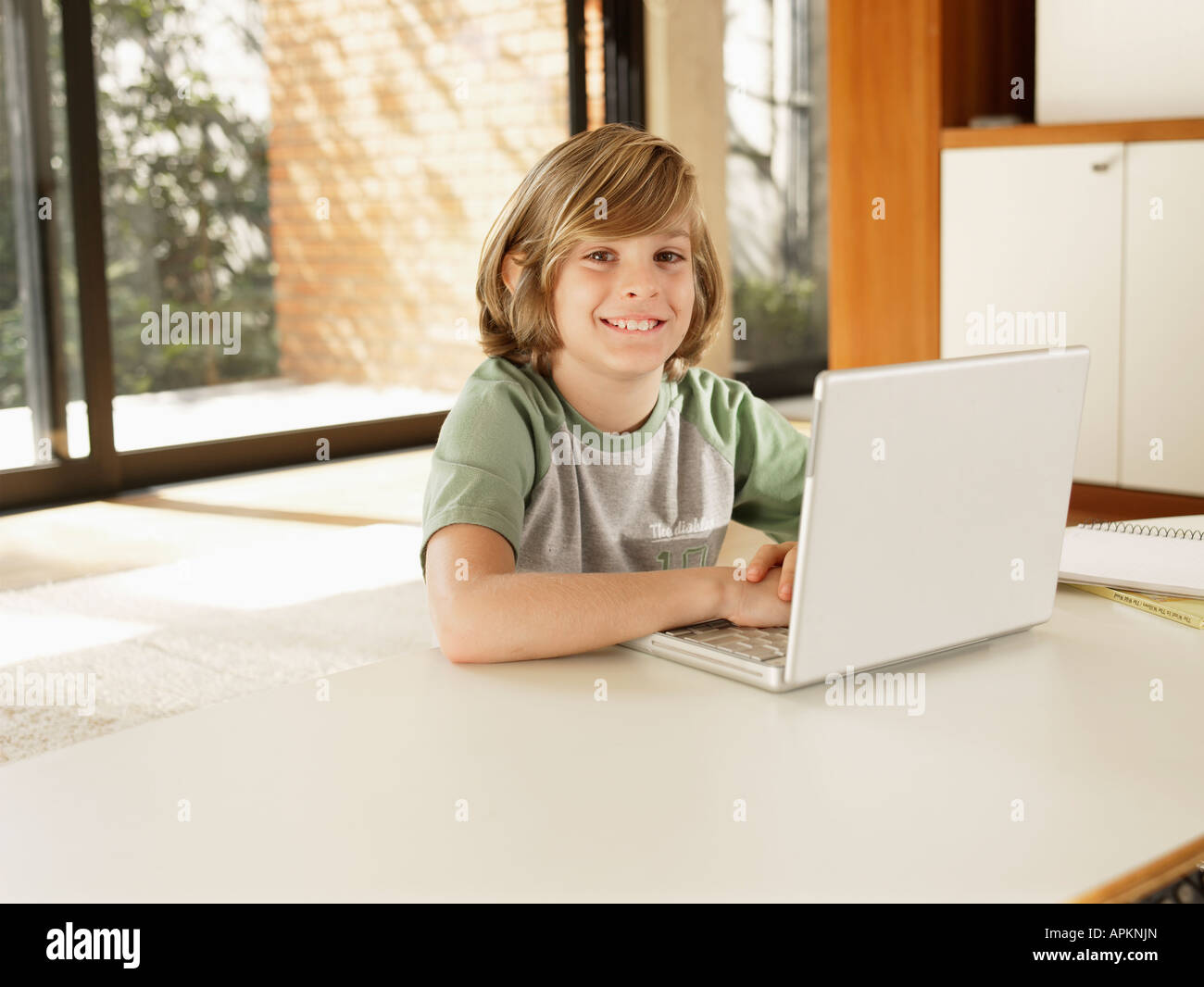 Boy using laptop computer (portrait Stock Photo - Alamy
