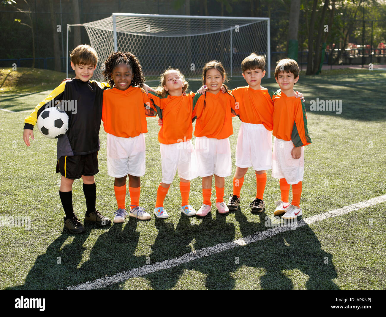 Children standing in soccer field (portrait Stock Photo - Alamy