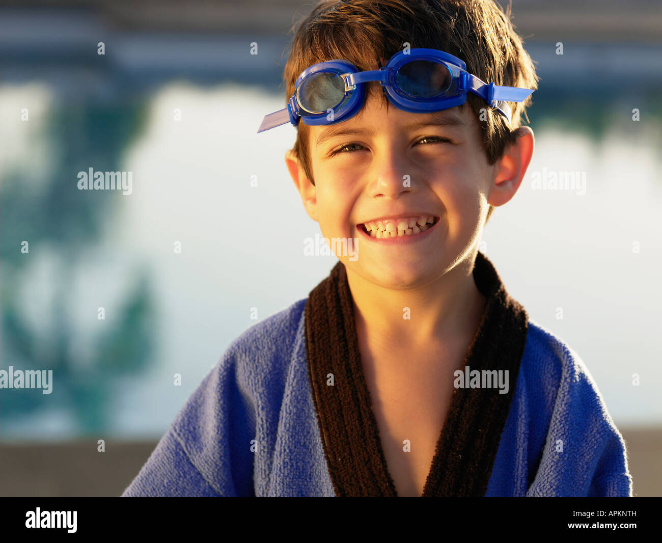 Boy wearing swimming goggles and gown (portrait Stock Photo - Alamy