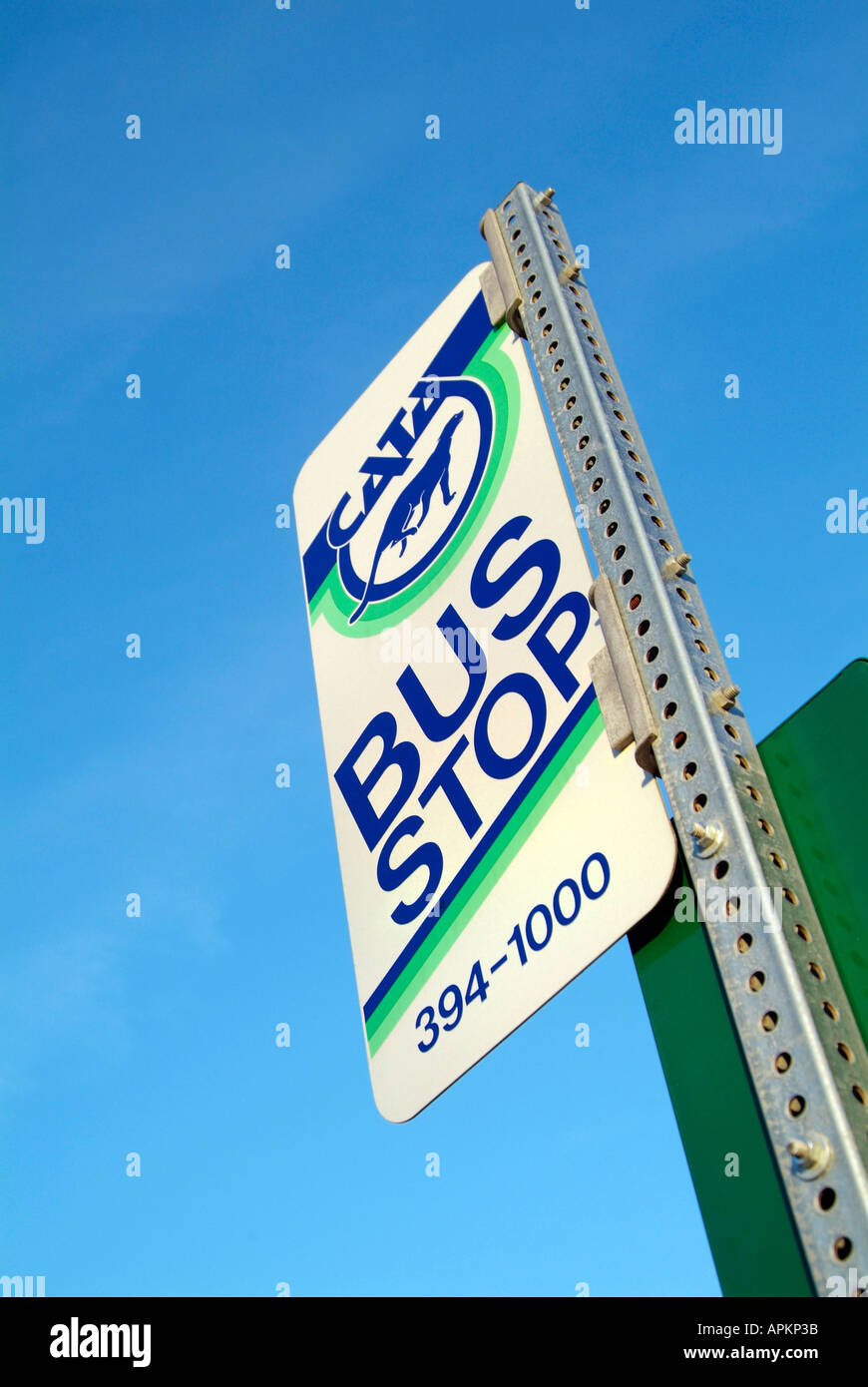 Bus Stop sign alerting public of a transportation stop Stock Photo - Alamy