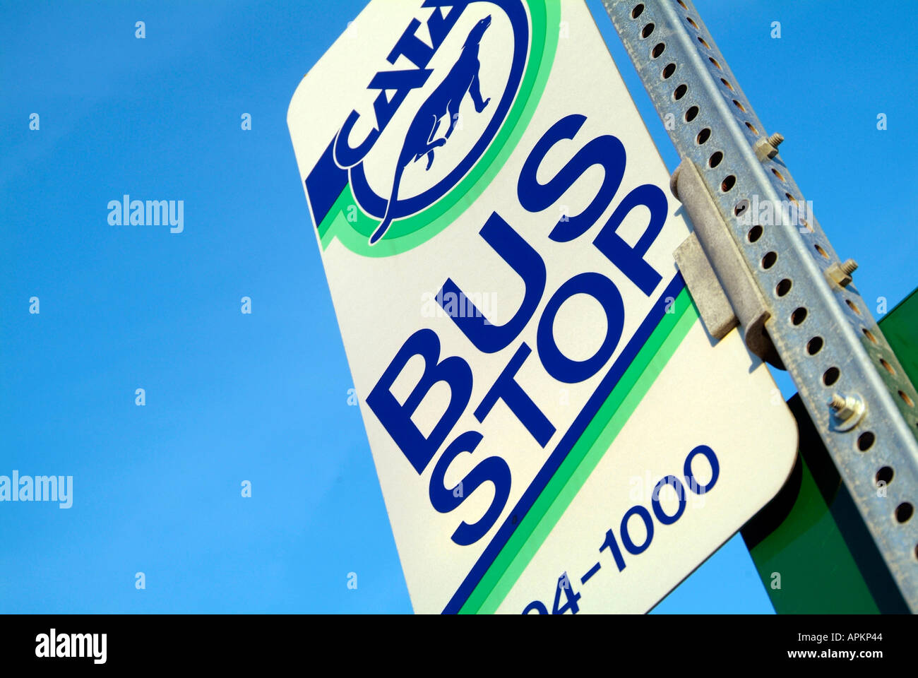 Bus Stop sign alerting public of a transportation stop Stock Photo - Alamy