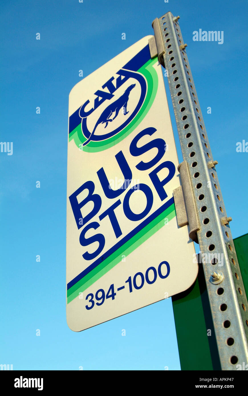 Bus Stop sign alerting public of a transportation stop Stock Photo - Alamy