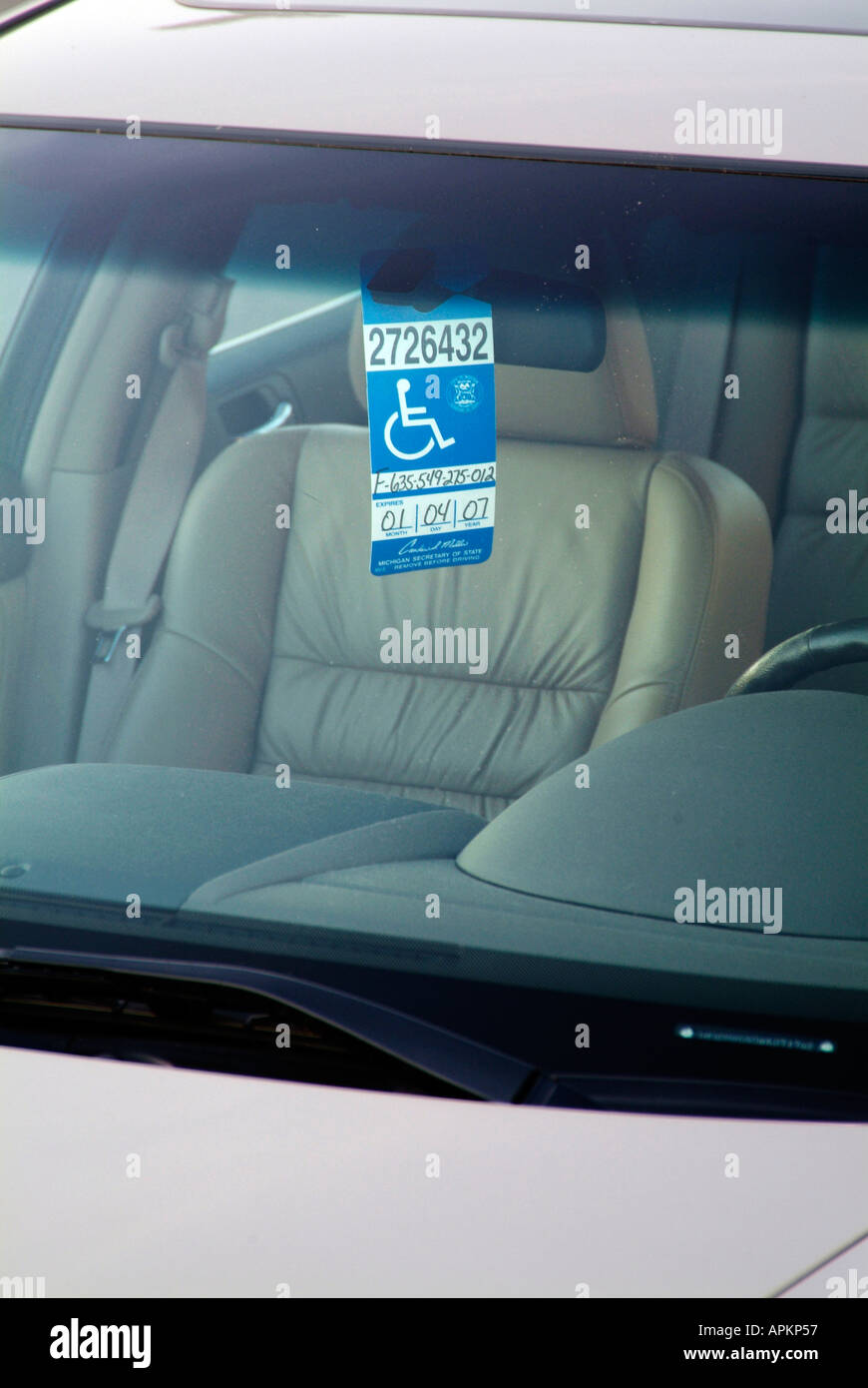 handicapped parking permit sign in a car windshield allows person to ...