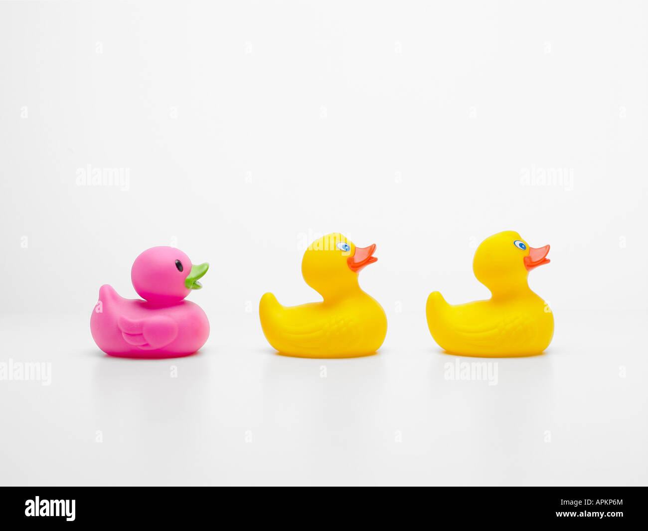 Three rubber ducks in row Stock Photo - Alamy