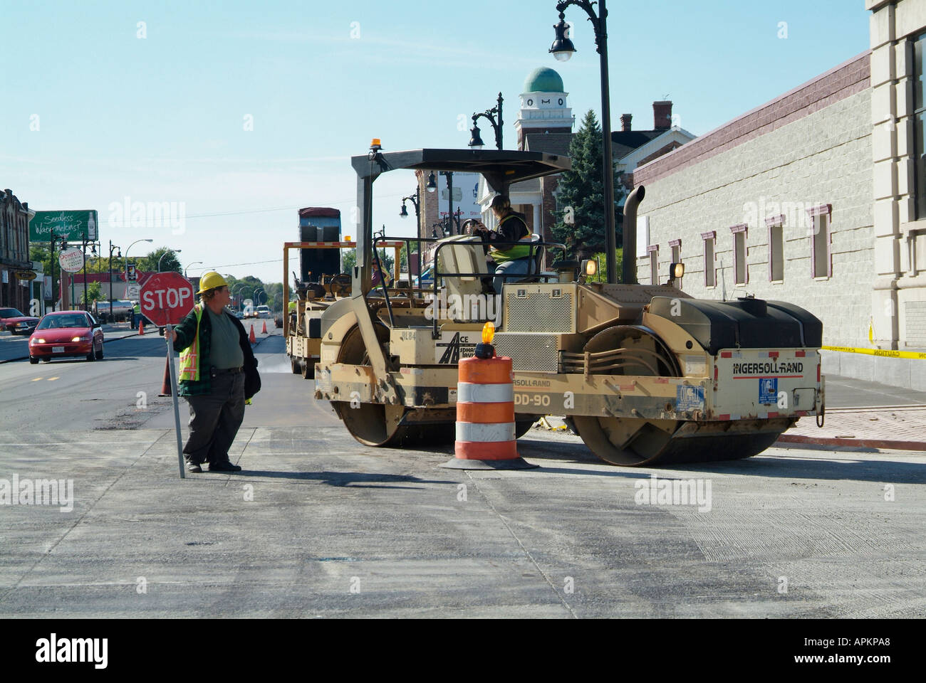 Asphalt paving of a street using heavy machinery Stock Photo - Alamy