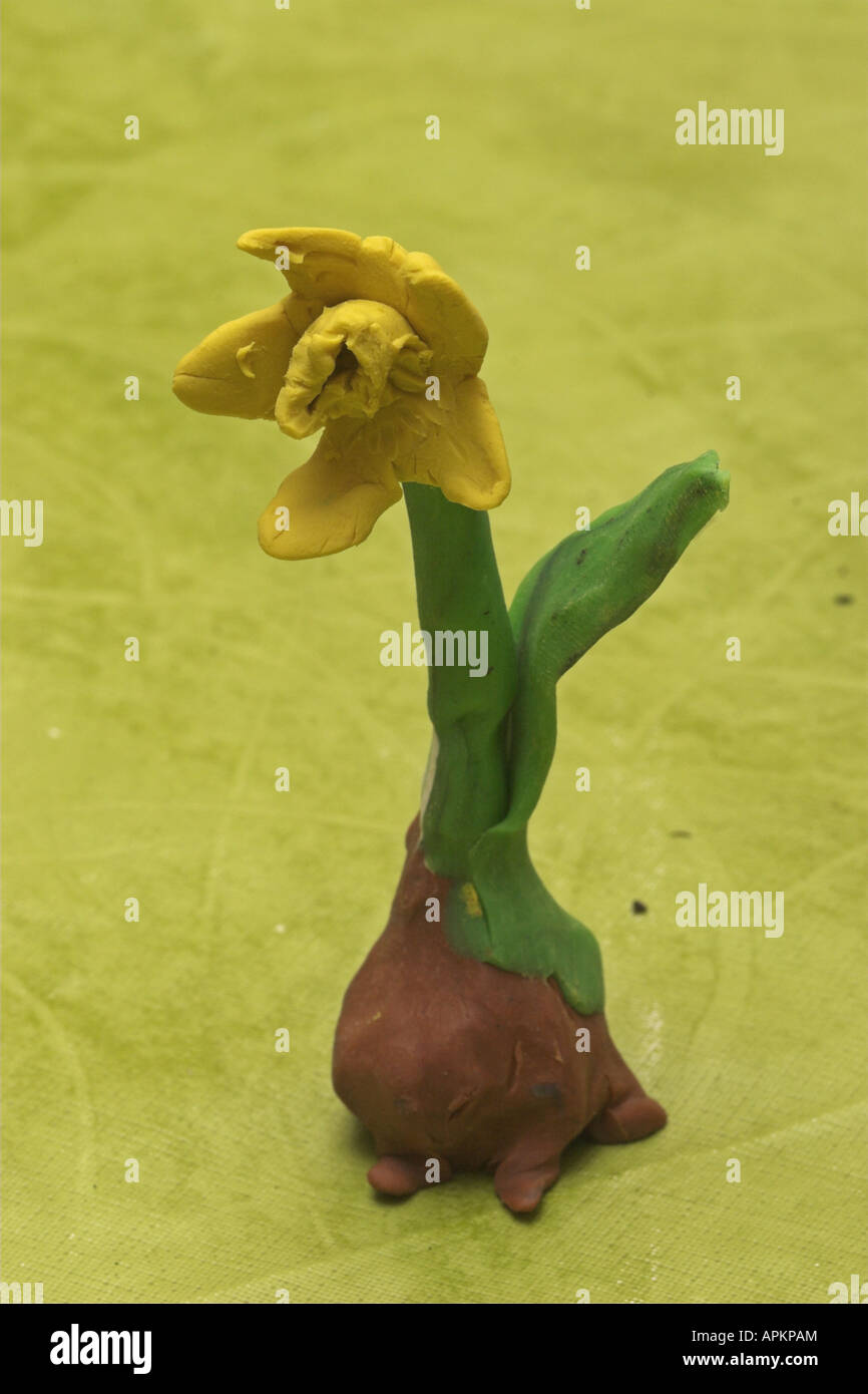 kids tinker flowers of modeling clay Stock Photo - Alamy