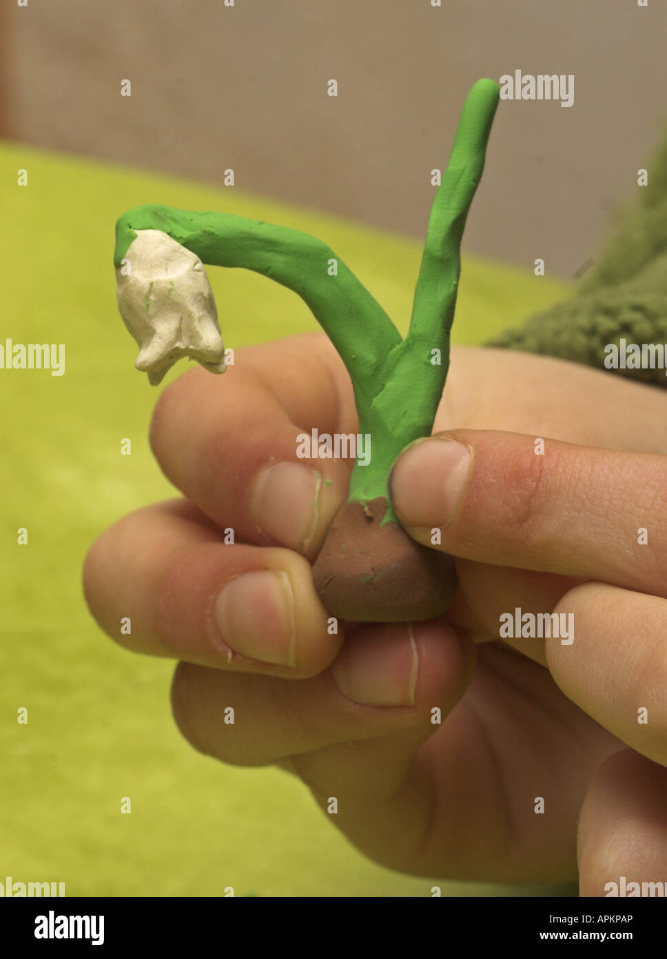 kids tinker flowers of modeling clay Stock Photo - Alamy