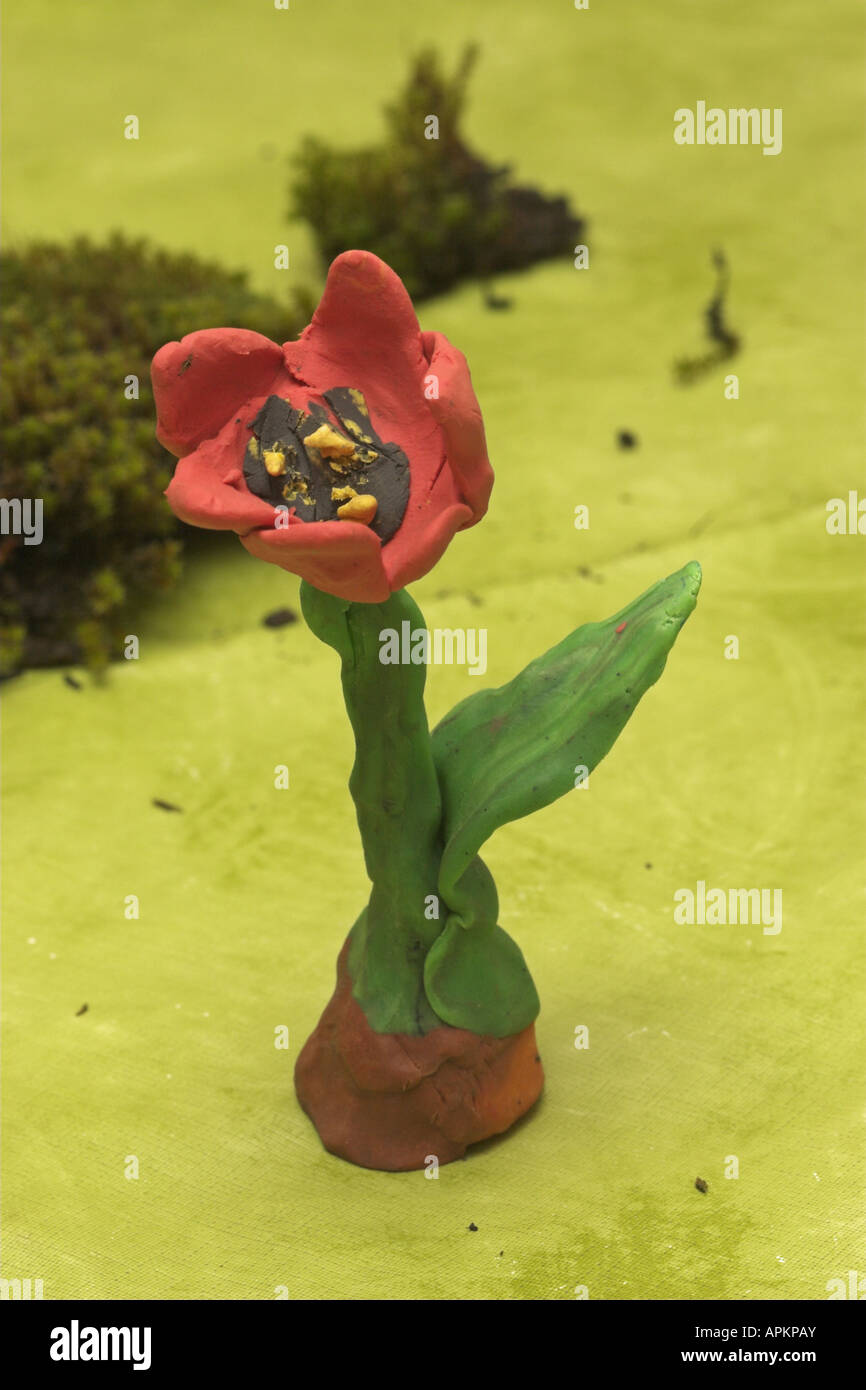 kids tinker flowers of modeling clay Stock Photo - Alamy