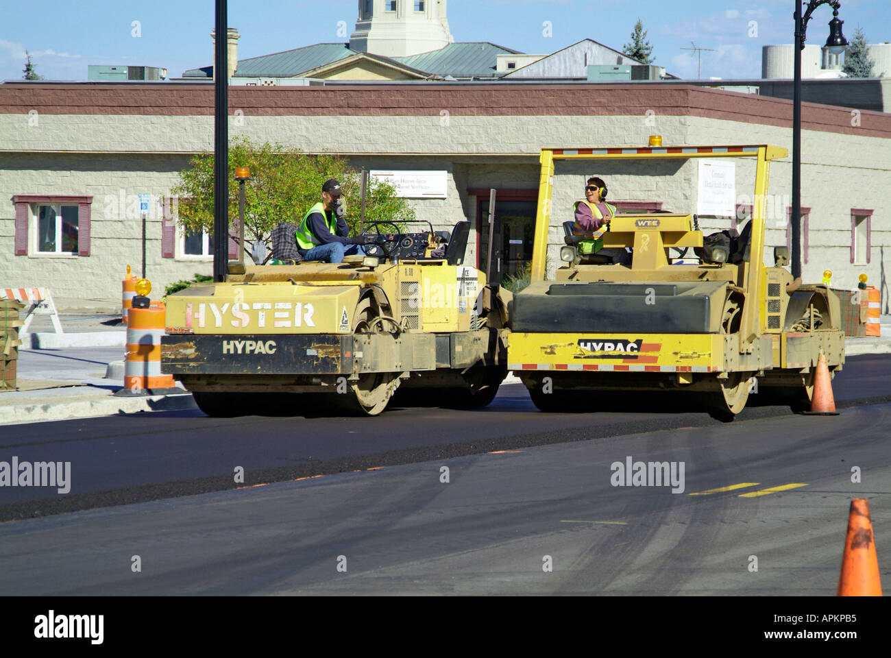 Asphalt paving of a street using heavy machinery Stock Photo - Alamy