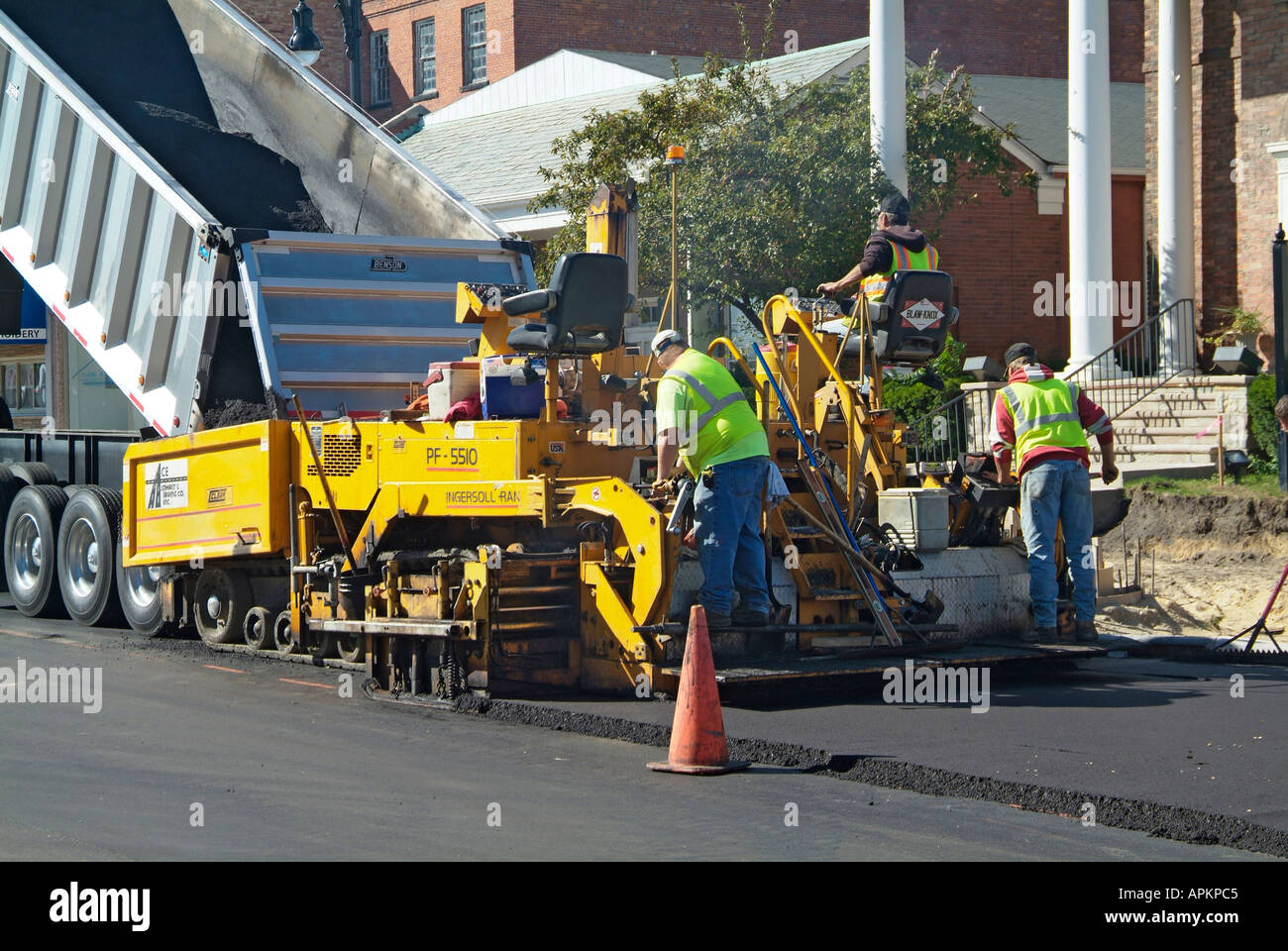 Asphalt paving of a street using heavy machinery Stock Photo - Alamy