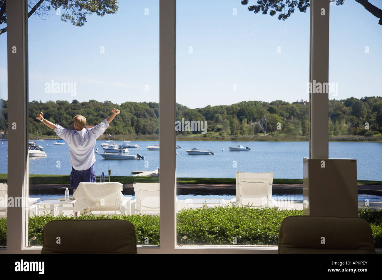 Man stretching by pool Stock Photo - Alamy