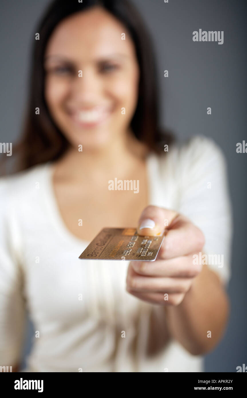 Woman showing credit card Stock Photo - Alamy