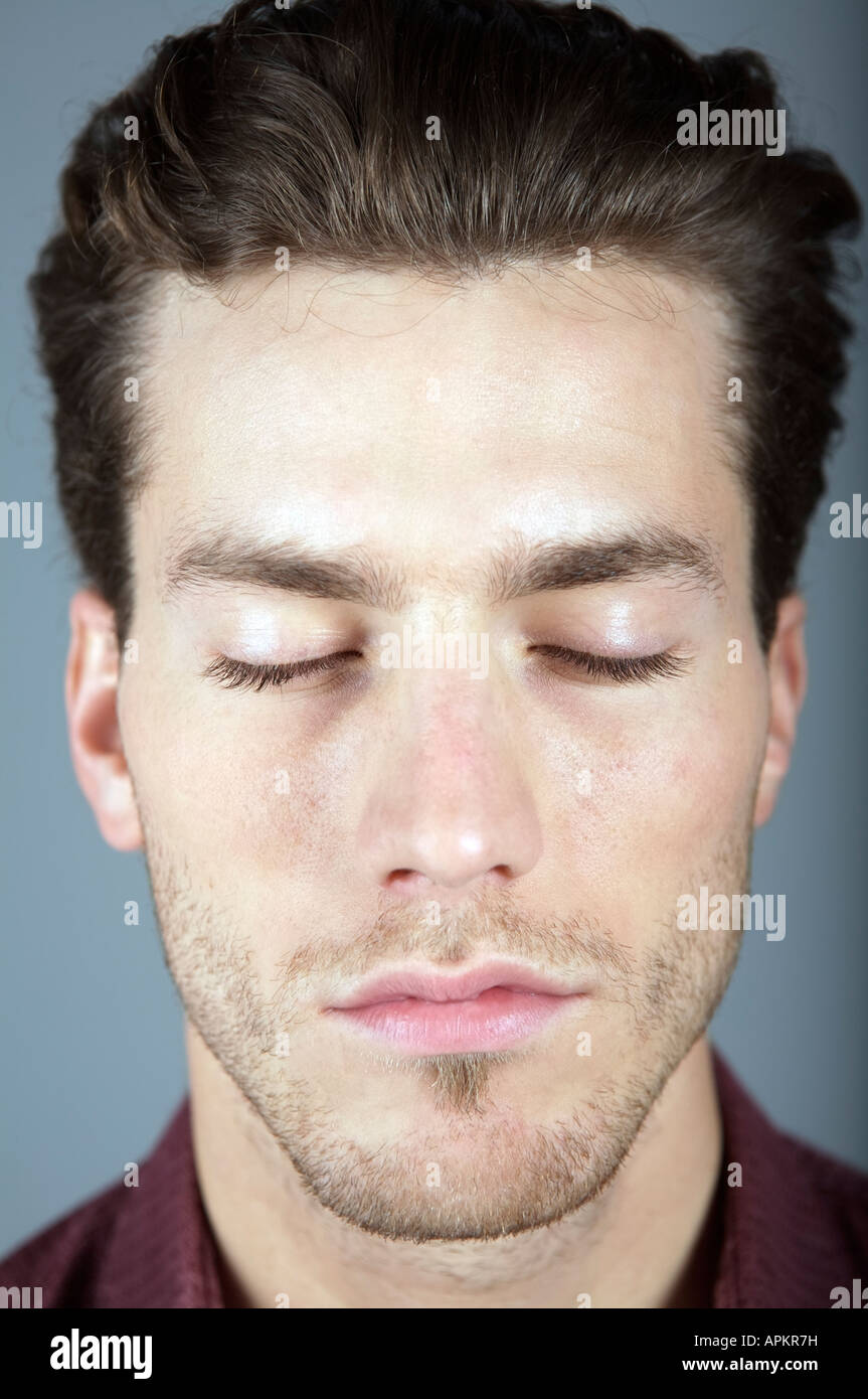 Portrait of young man, eyes closed Stock Photo - Alamy