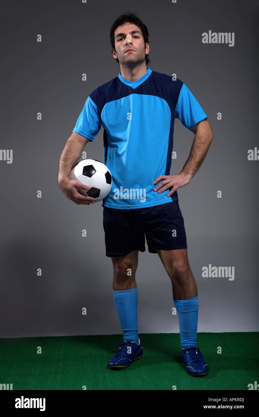 Football player with ball Stock Photo - Alamy