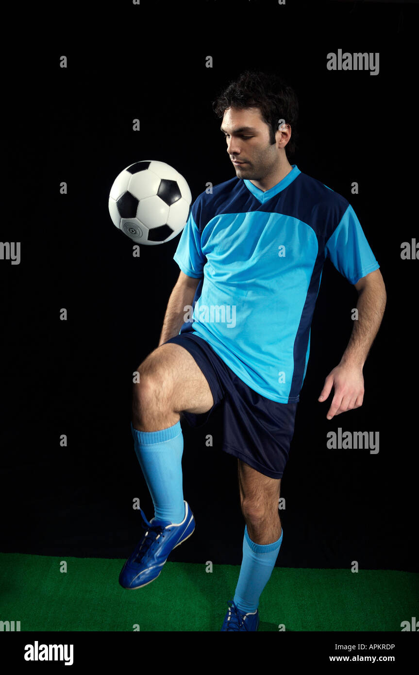 Football player with ball Stock Photo - Alamy