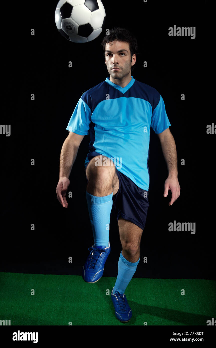 Football player with ball Stock Photo - Alamy