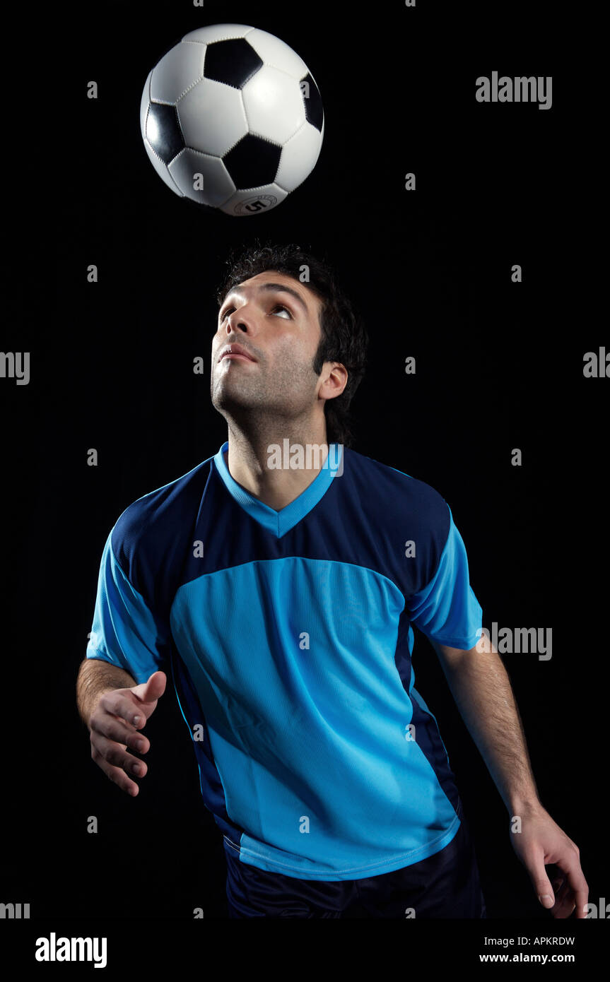 Football player with ball Stock Photo - Alamy