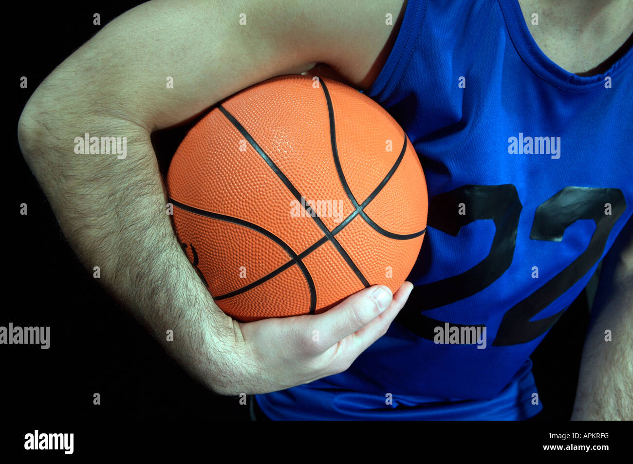 Basketball player with ball Stock Photo - Alamy