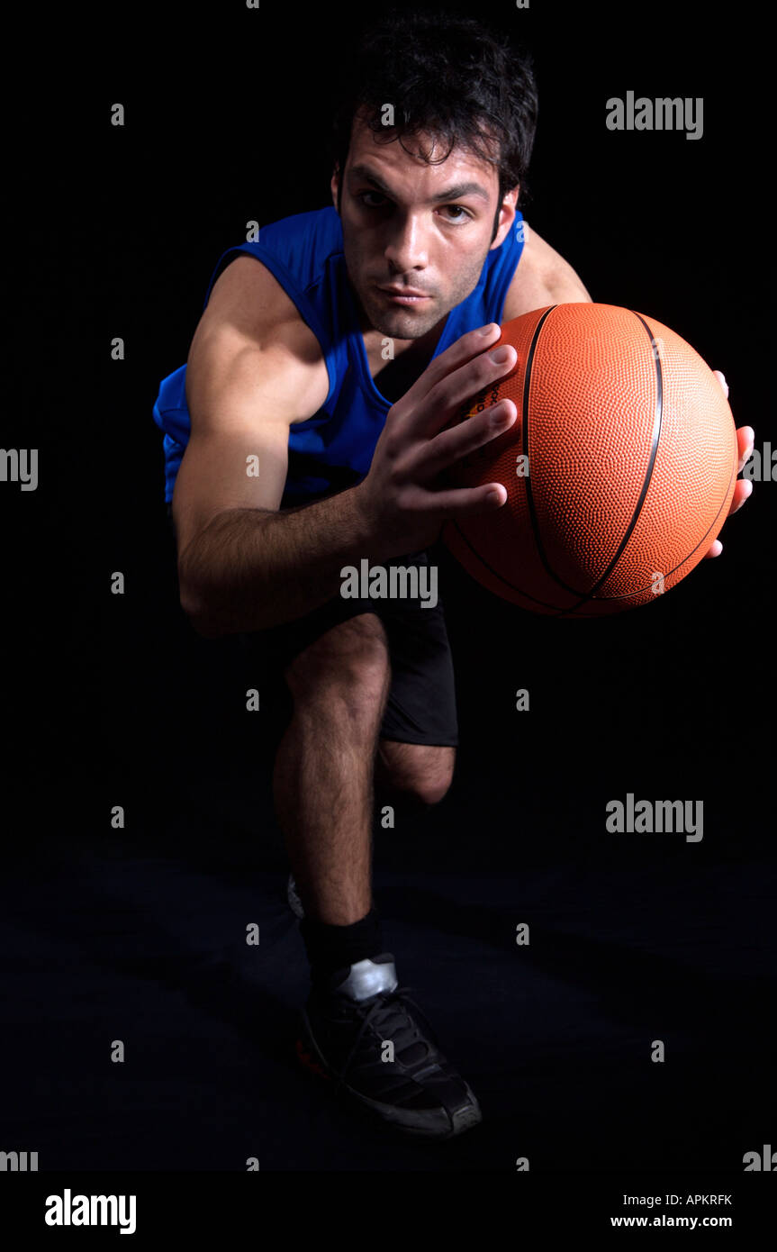 Basketball player with ball Stock Photo - Alamy