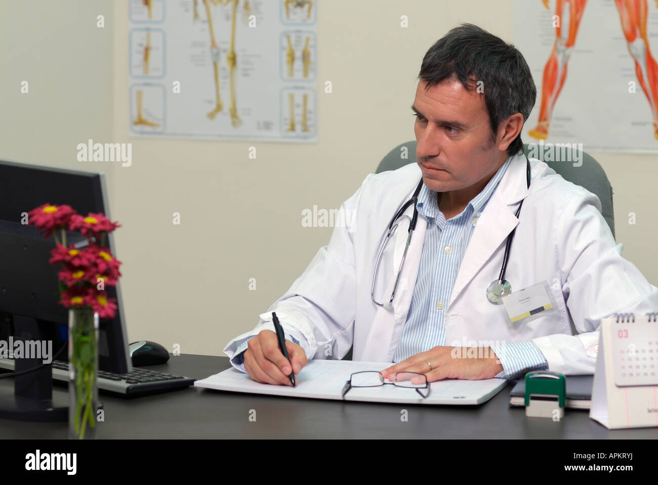 Doctor in his office Stock Photo - Alamy