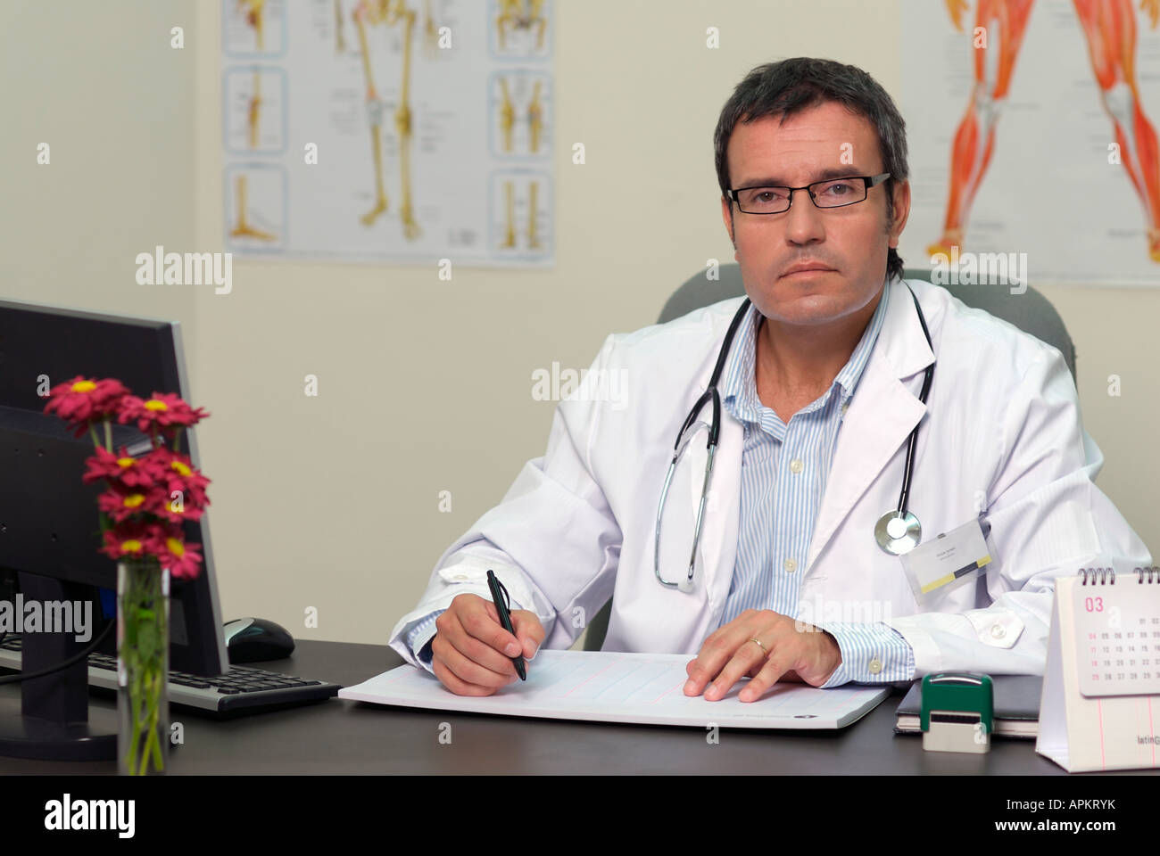 Doctor in his office Stock Photo - Alamy