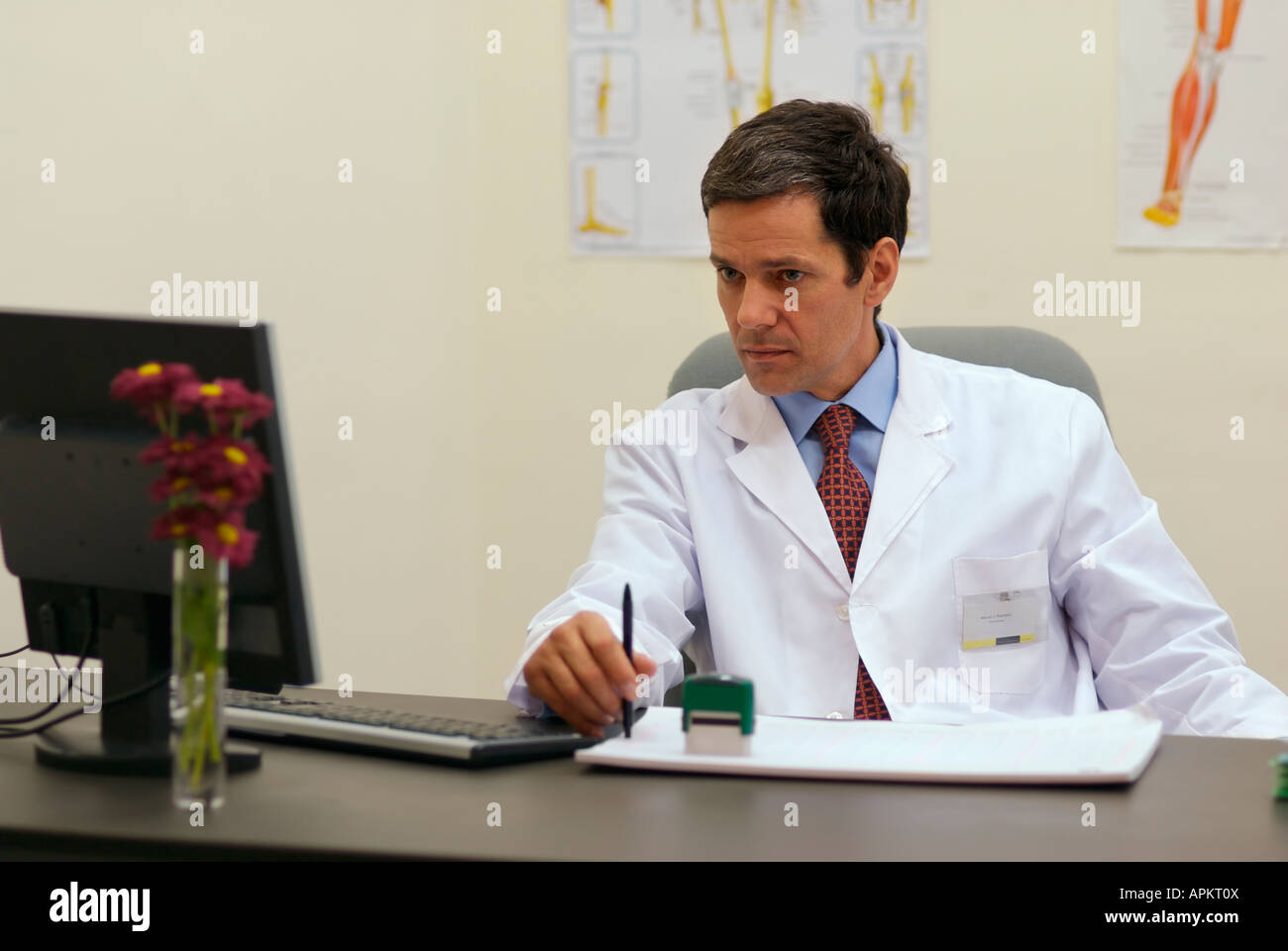 Doctor in an office Stock Photo - Alamy