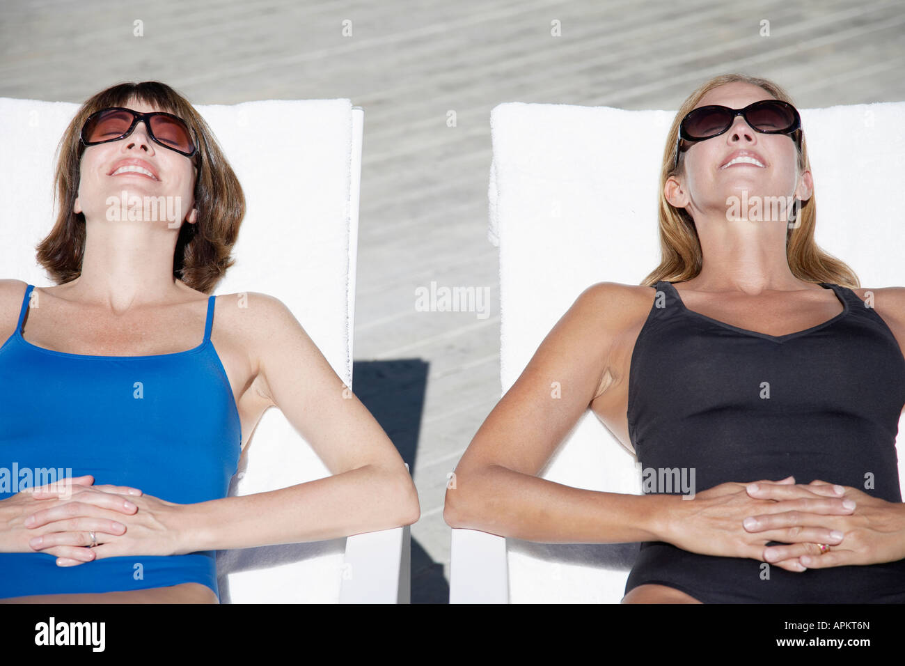 Sunbathing lying on stomach hi-res stock photography and images - Alamy