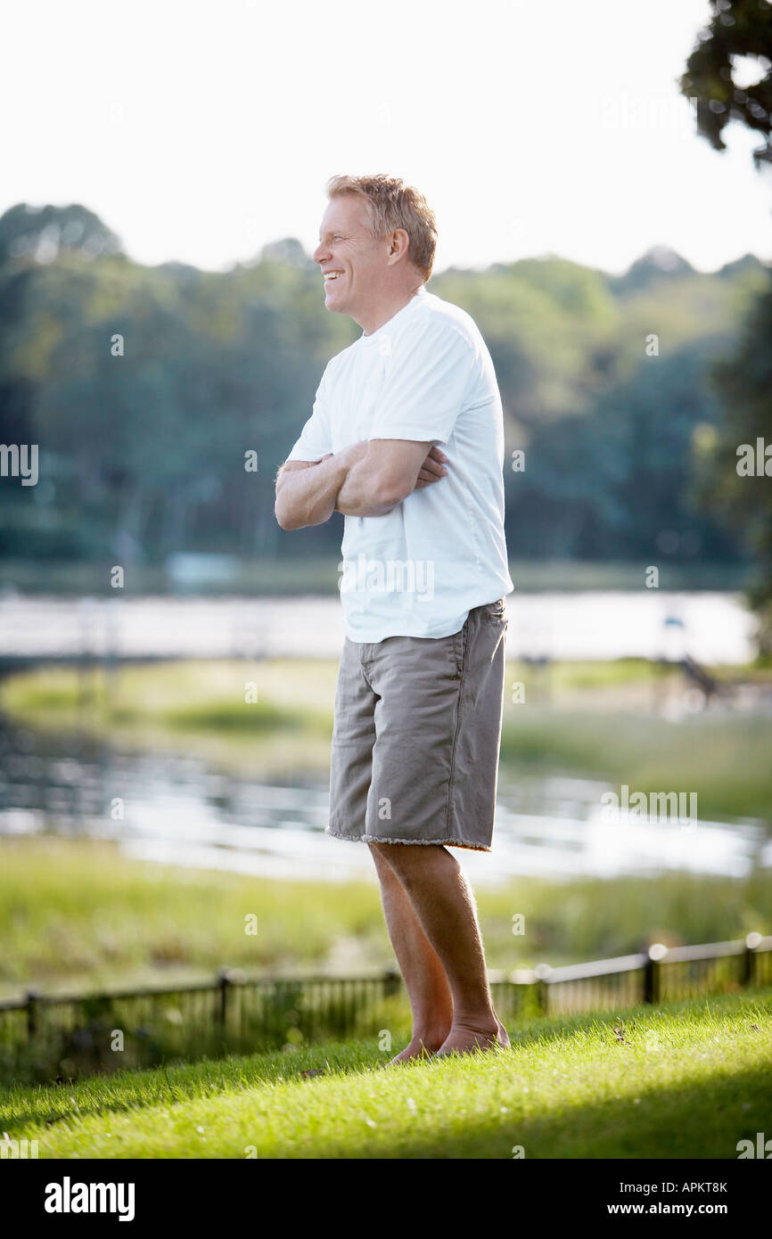 Man standing on lawn and laughing Stock Photo - Alamy