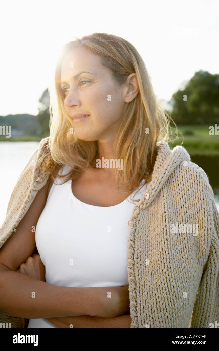 Woman looking into distance (lens flare Stock Photo - Alamy