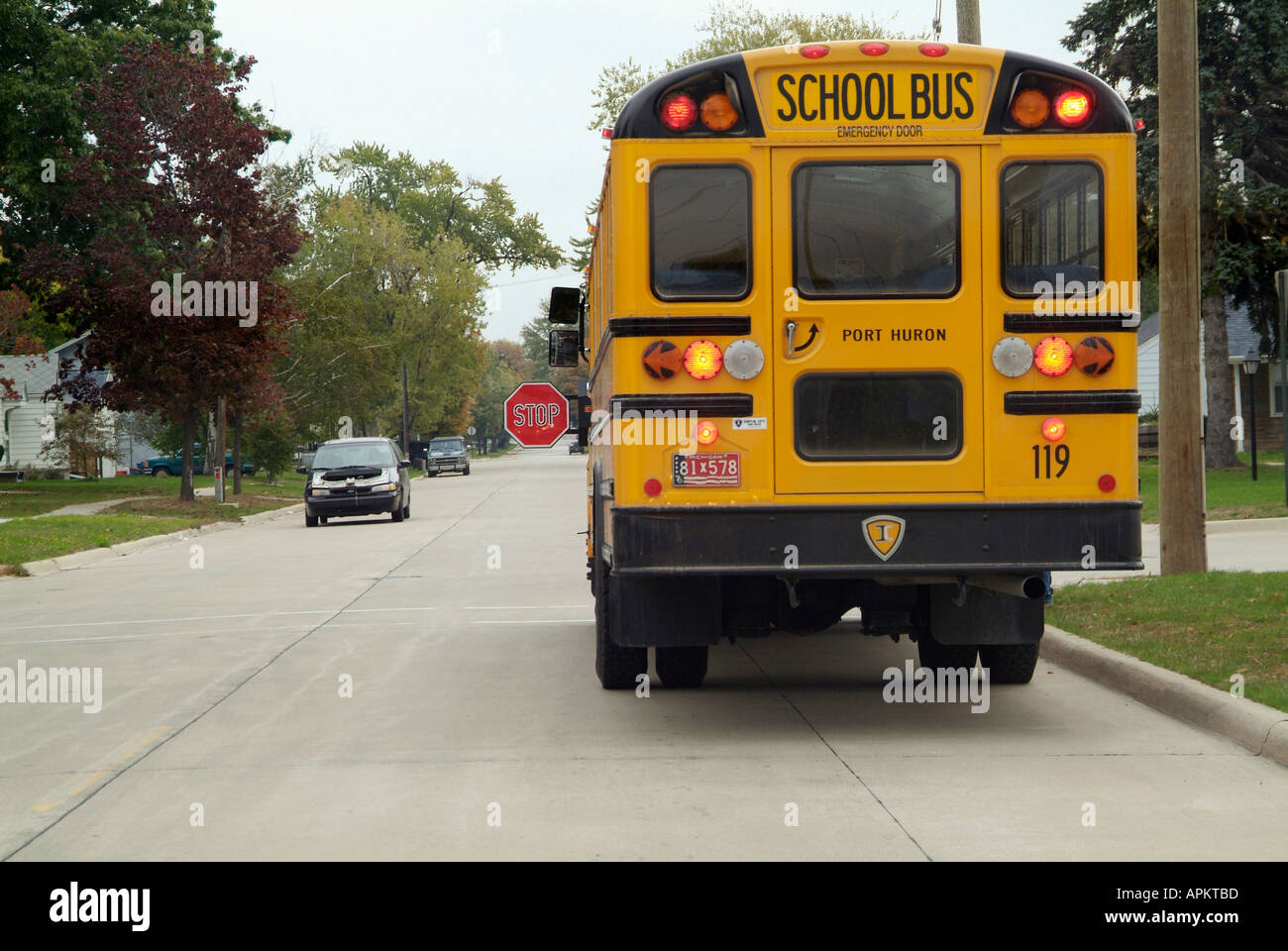 School bus stops traffic to let children safely exit and enter Stock ...