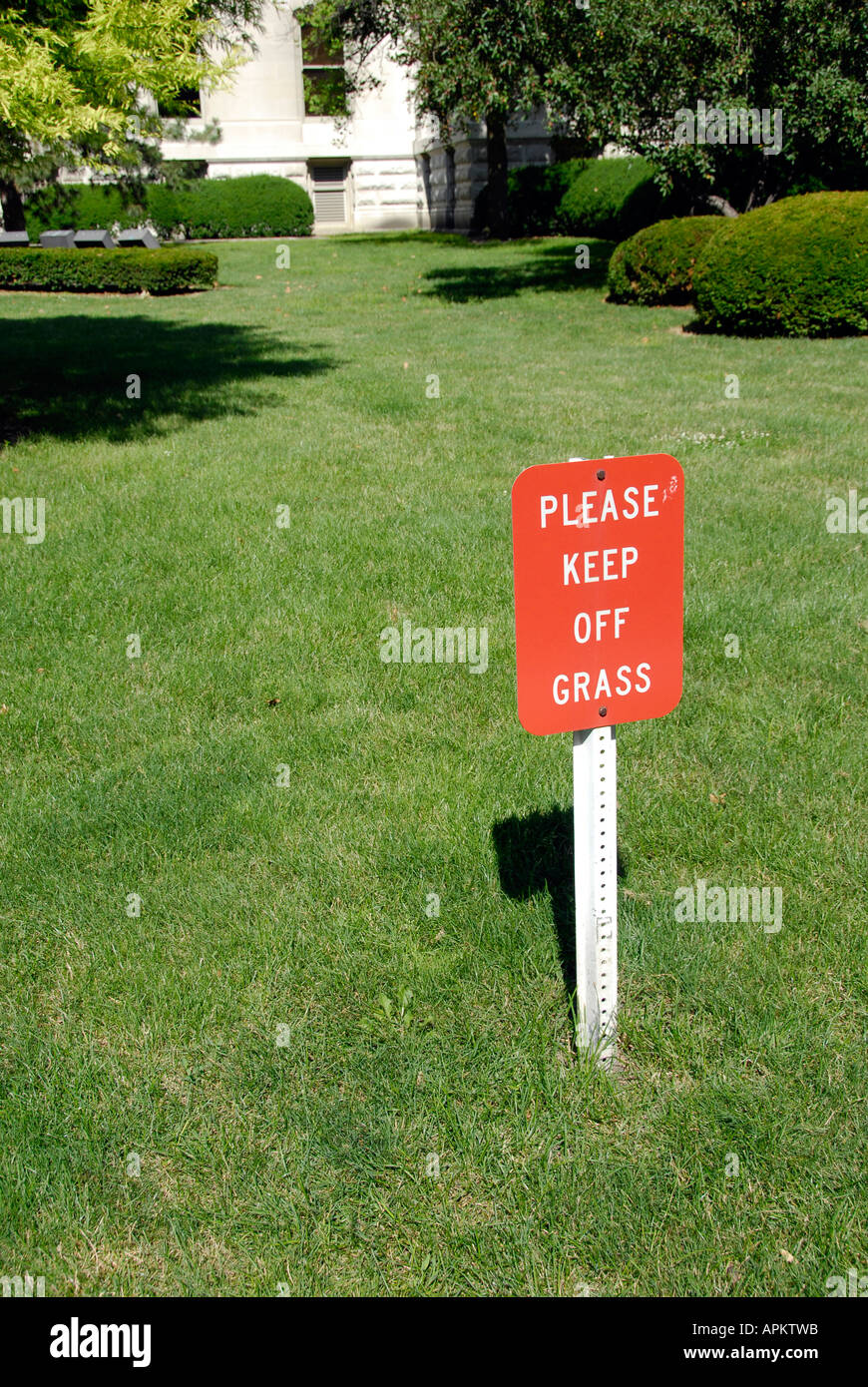 Red sign with white letters reads Please Keep Off Grass Stock Photo - Alamy