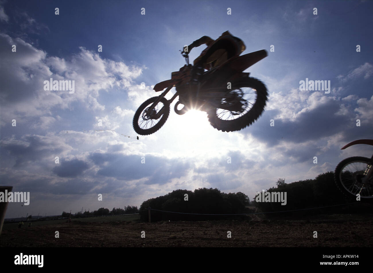 Motocross racing, mid air jump Stock Photo - Alamy