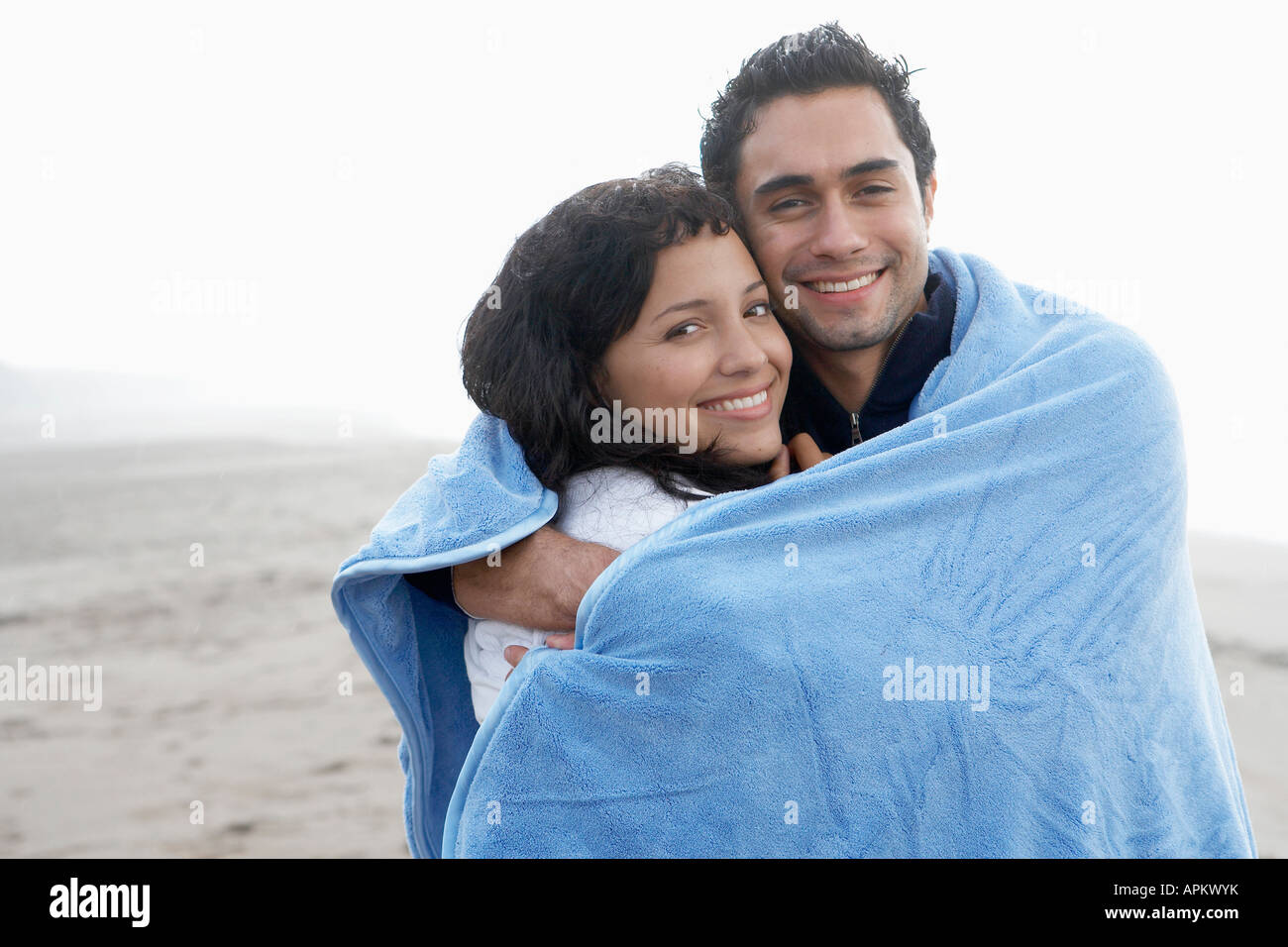 Young couple wrapped in towel (portrait Stock Photo - Alamy