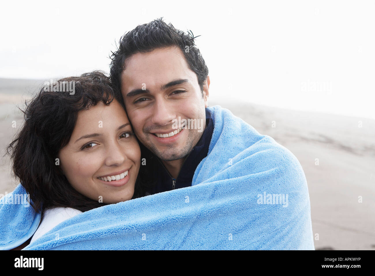 Young couple wrapped in towel (portrait Stock Photo - Alamy