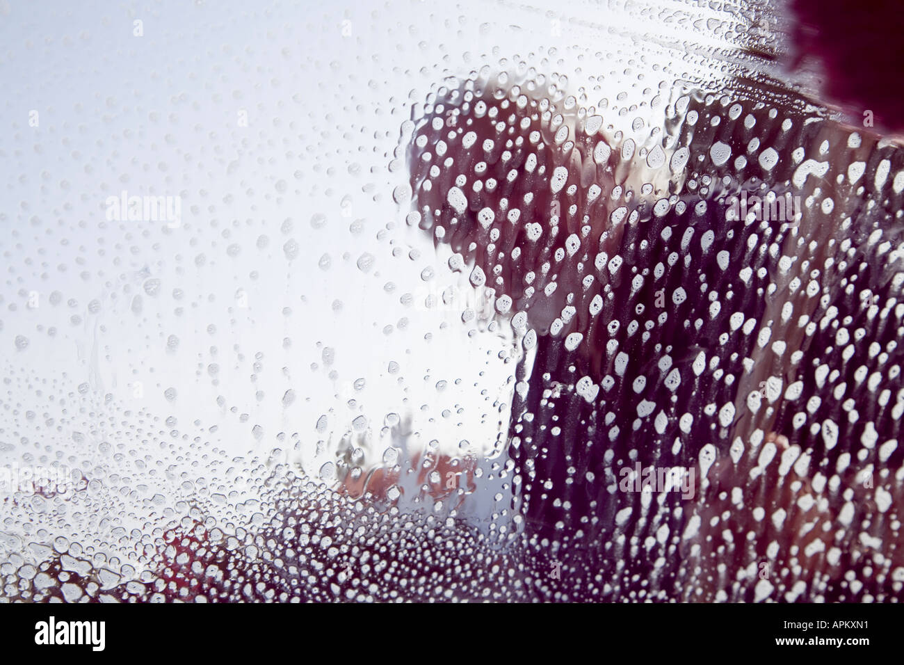 Figure washing car windscreen Stock Photo - Alamy