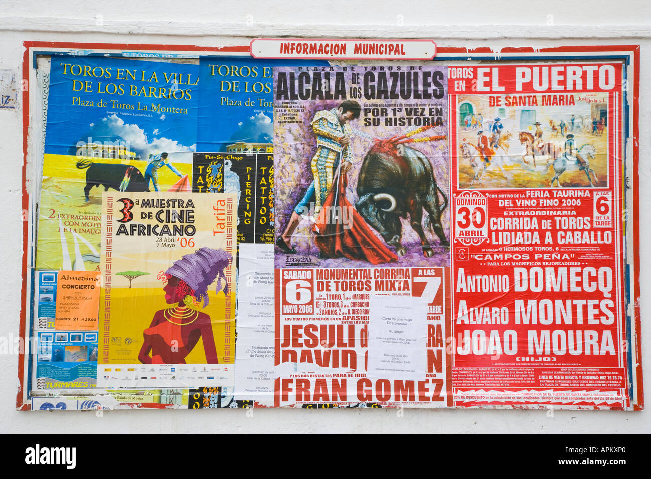 Collection of posters on southern Spanish wall Stock Photo - Alamy