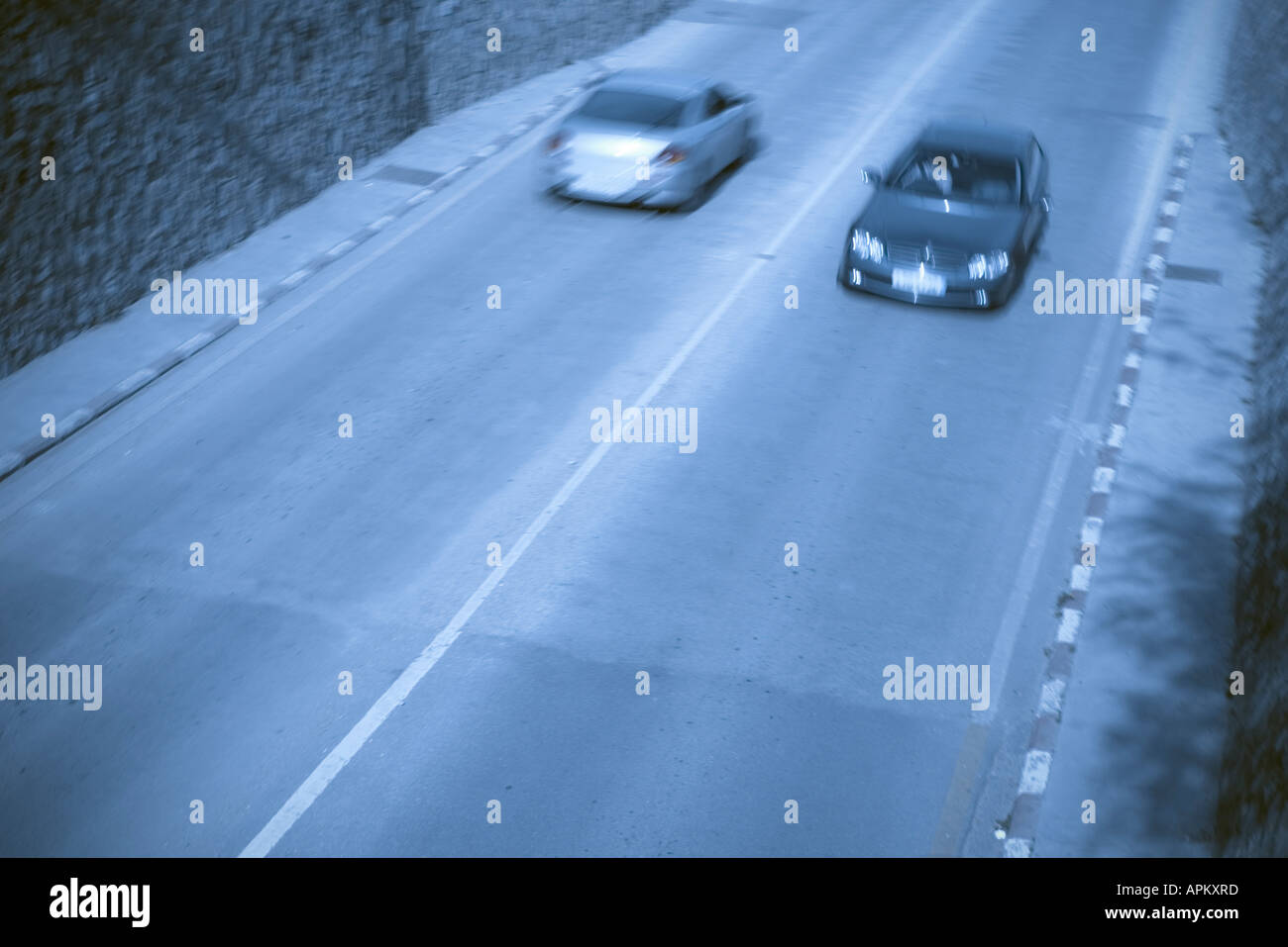 Two cars on highway Stock Photo - Alamy