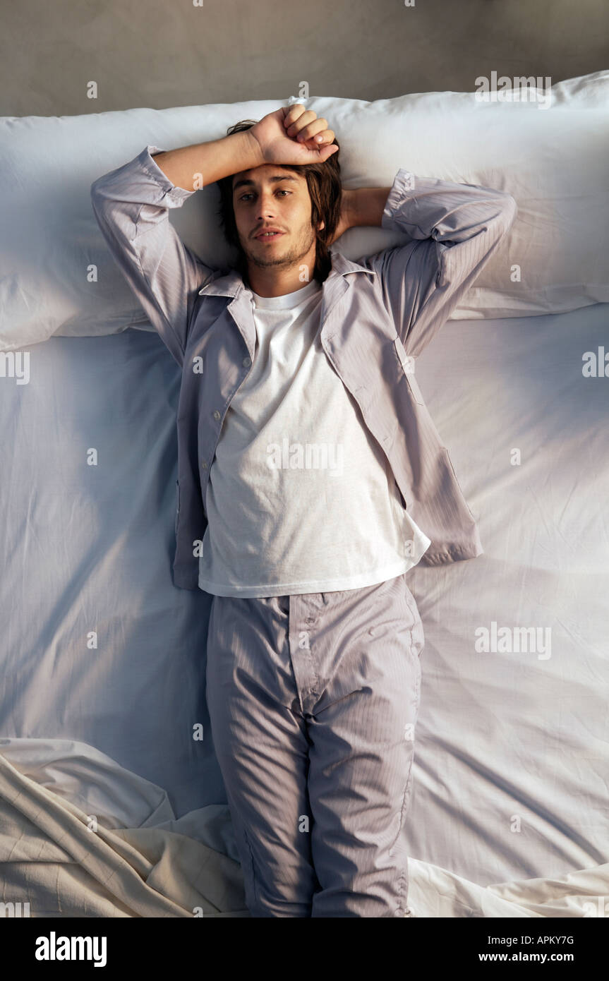 Man in bed Stock Photo - Alamy